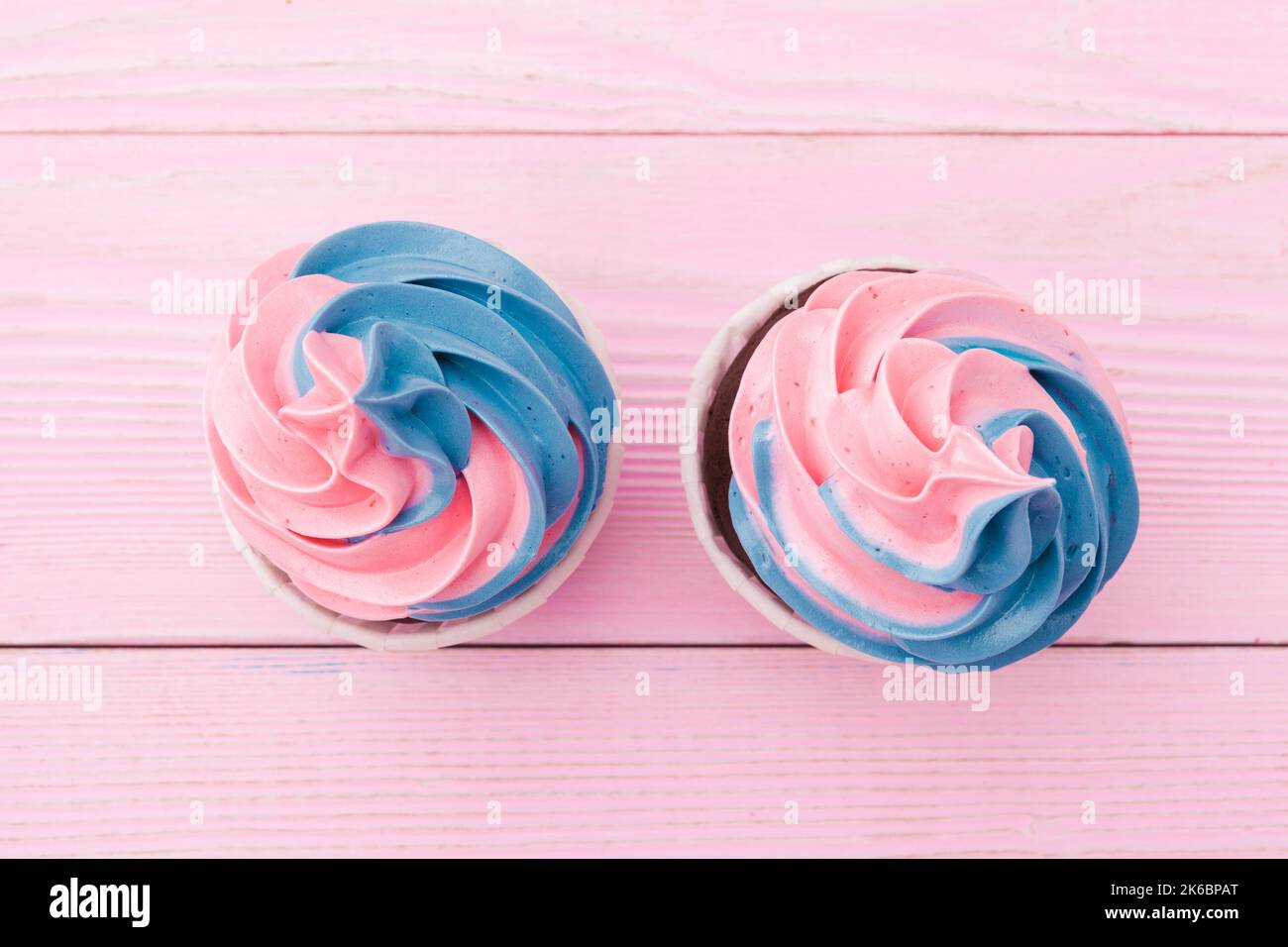 Side view of yummy cupcakes with assorted flavor. Shot on the table ...