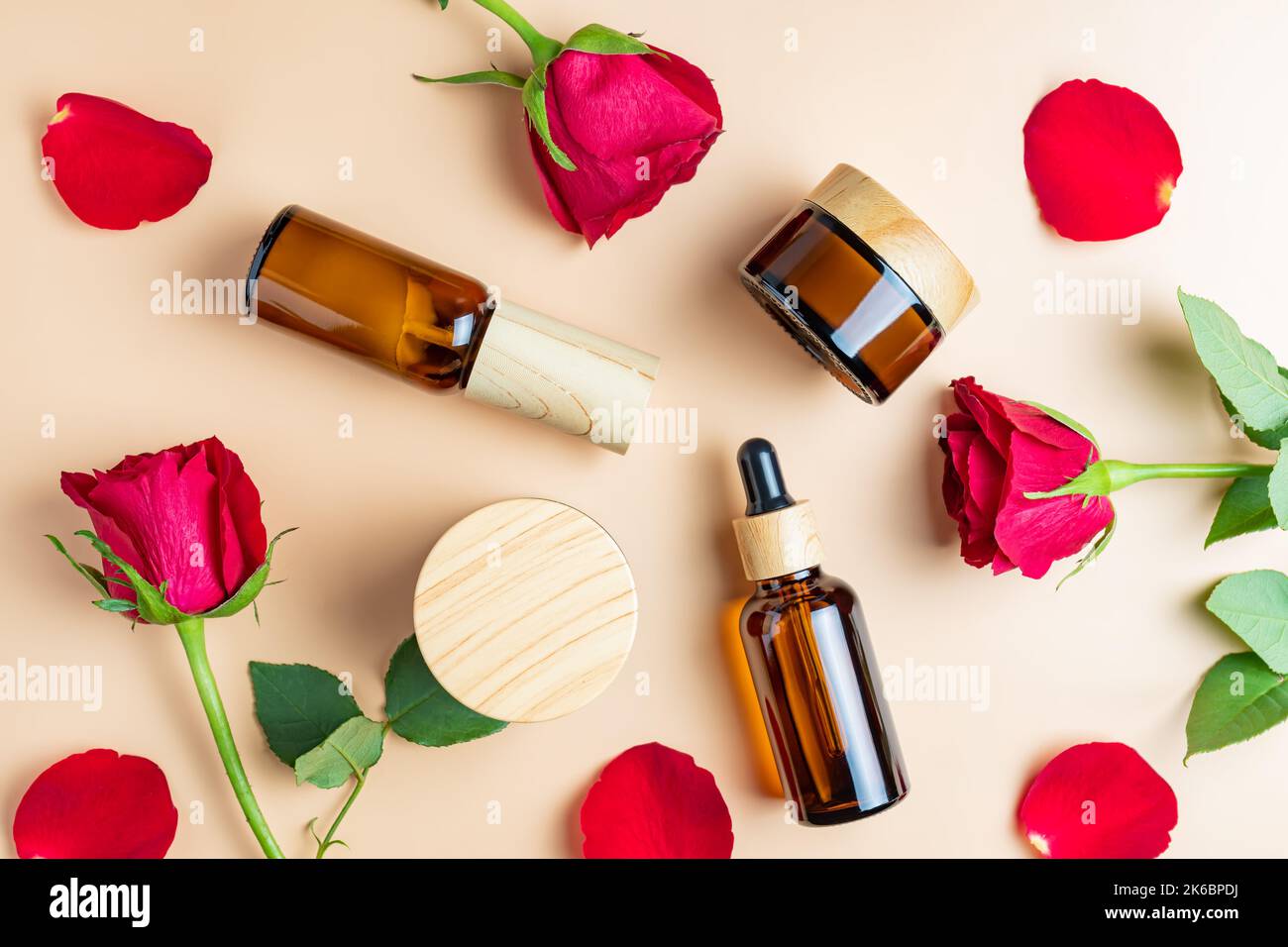 Top view of srt of femalle skin care cosmetics set. Dark glass bottles ...