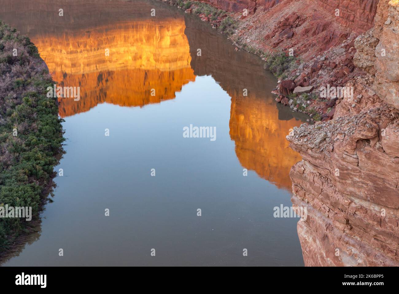 Sunrise view of the Cutler sandstone wall of Meander Canyon reflected ...