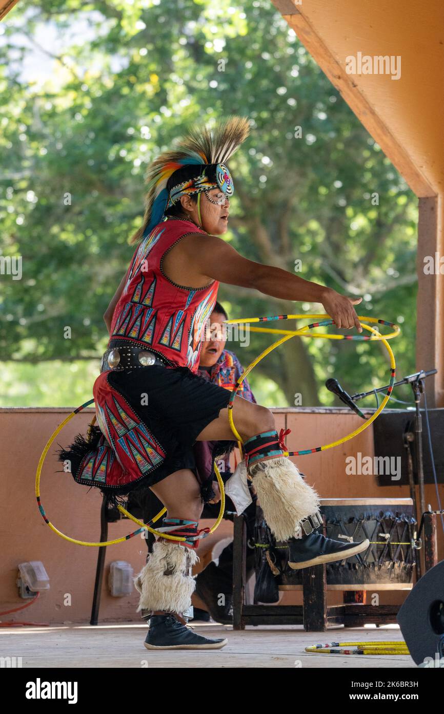 Navajo Native American hoop dancer in regalia performing at a festival ...