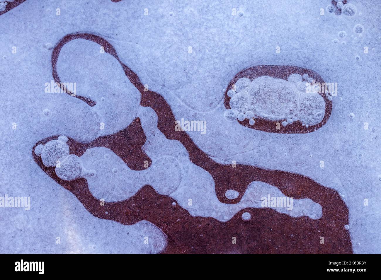 Frozen patterns in ice on sandstone in winter at Dead Horse Point State ...