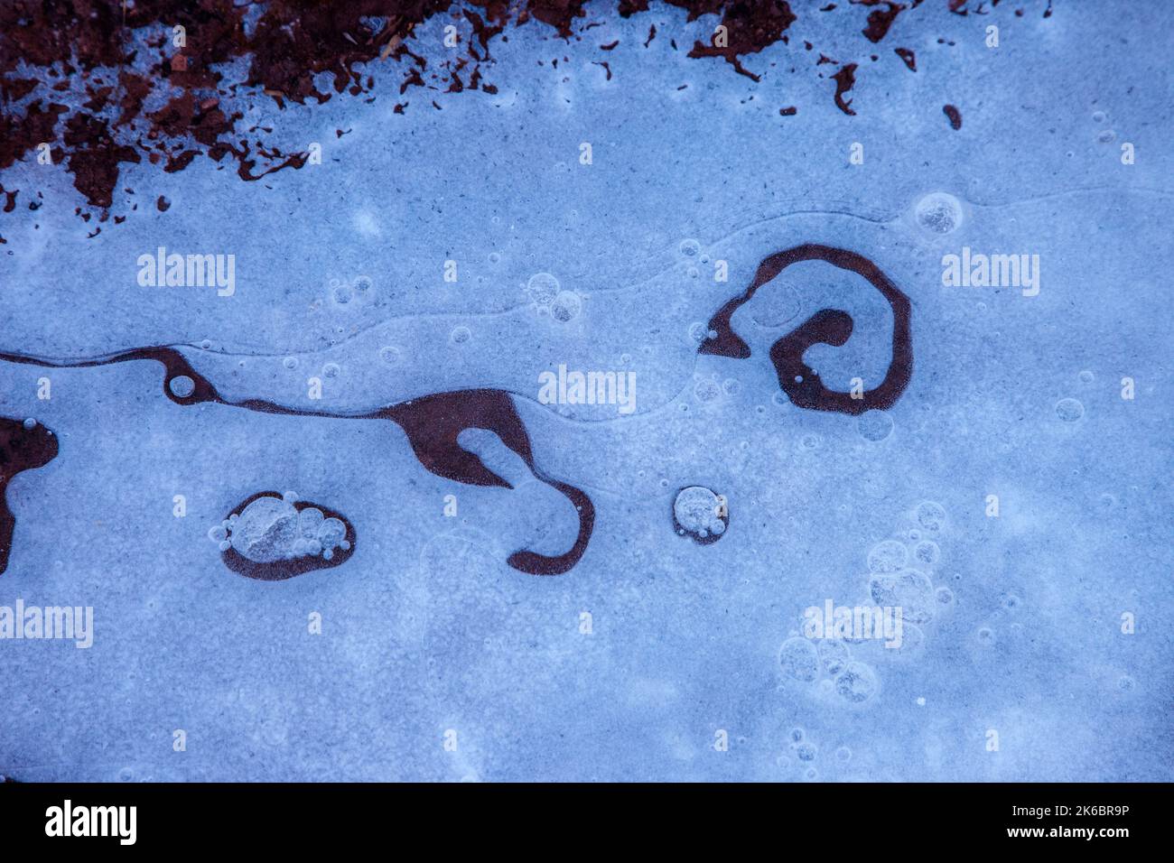 Frozen patterns in ice on sandstone in winter at Dead Horse Point State ...