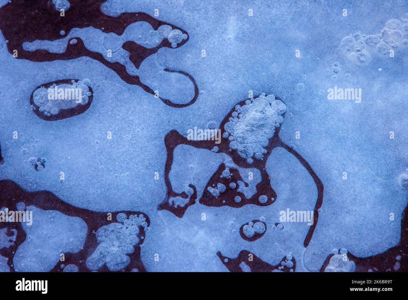 Frozen patterns in ice on sandstone in winter at Dead Horse Point State ...