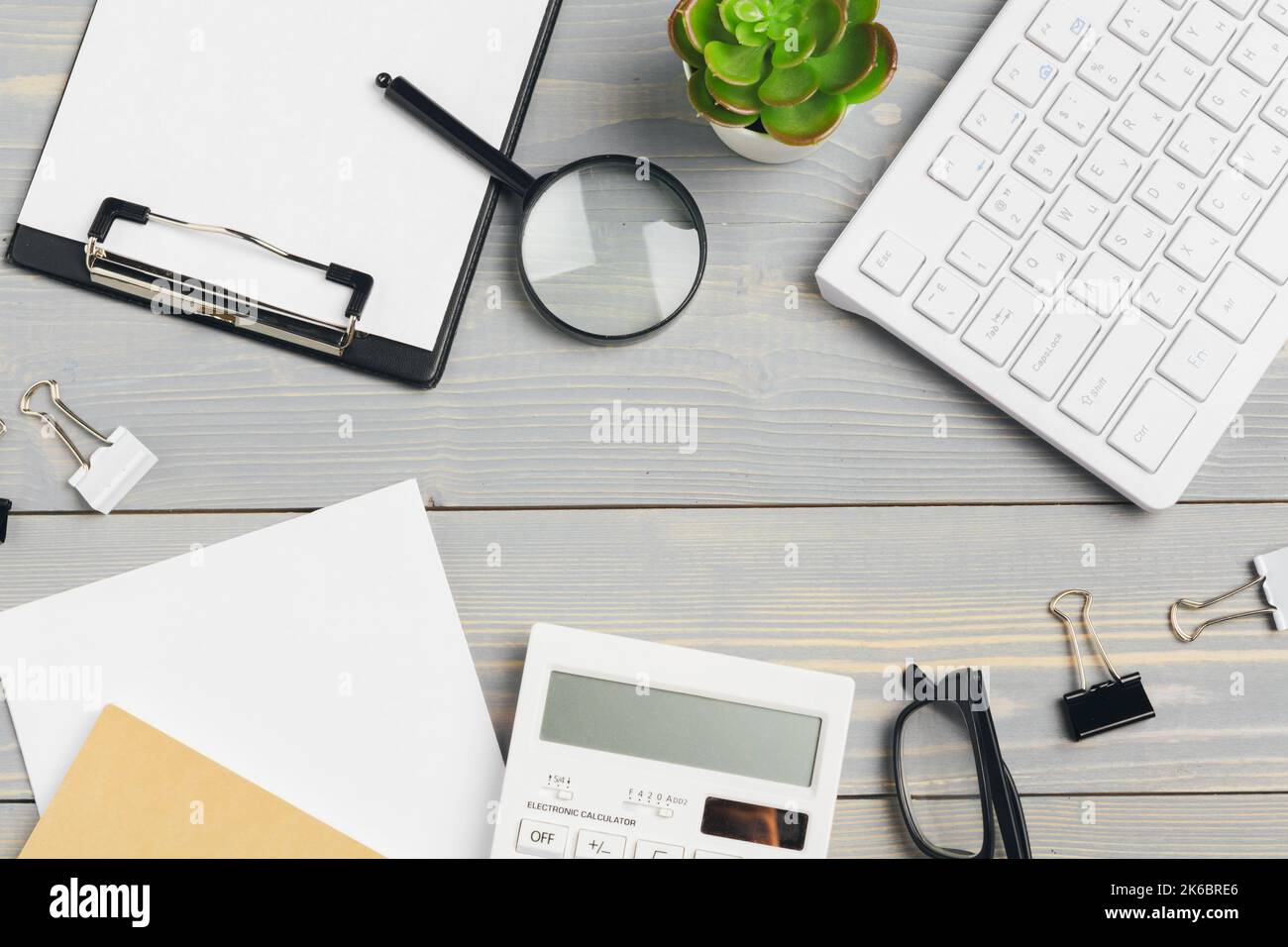 Office tools on gray wooden background top view close up Stock Photo ...