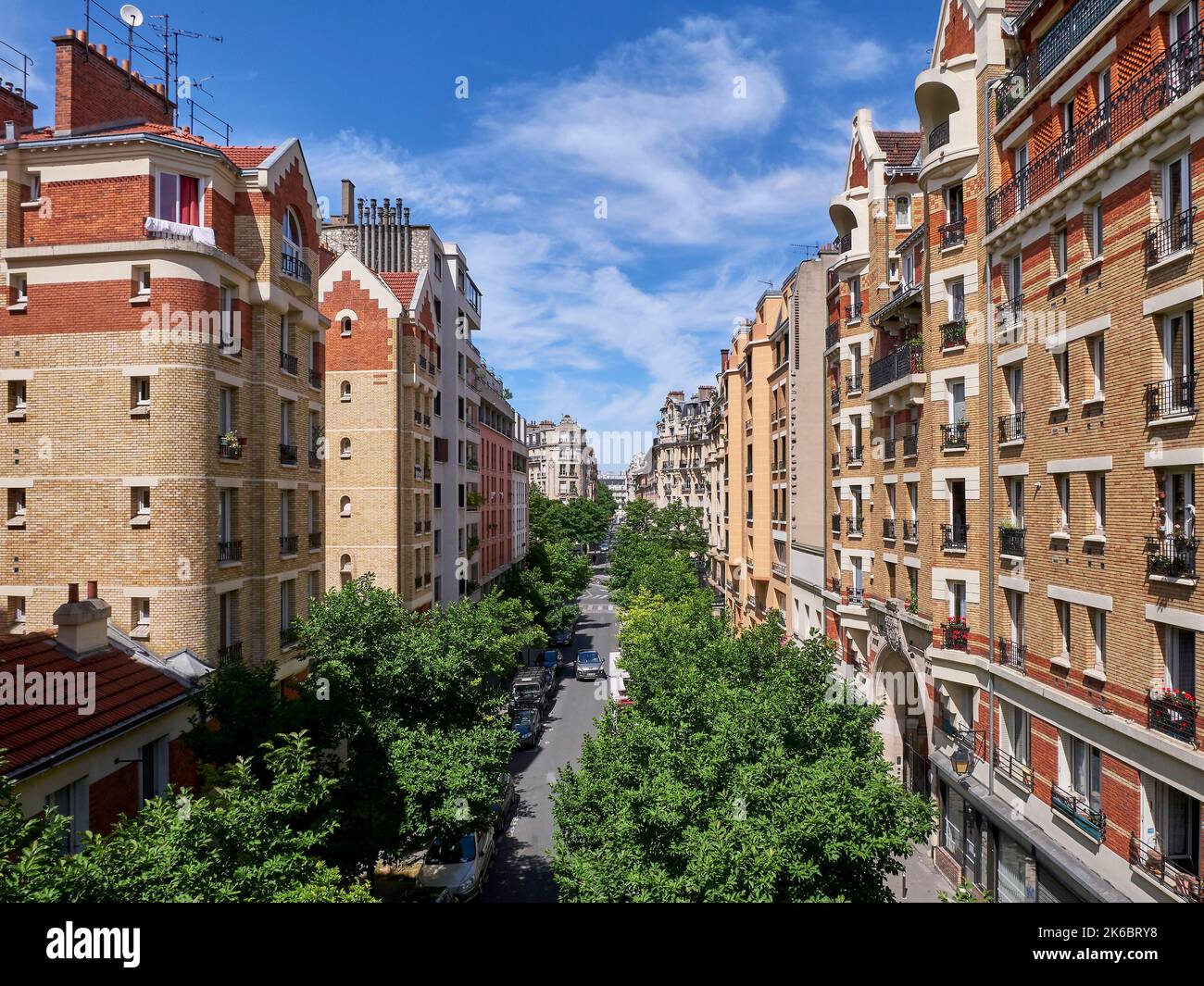 Green belt, pedestrian zone in Paris, with buildings and trees in “rue ...