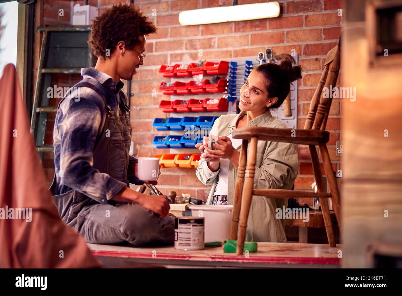 Couple Running Business In Workshop At Home Restoring And Upcycling ...