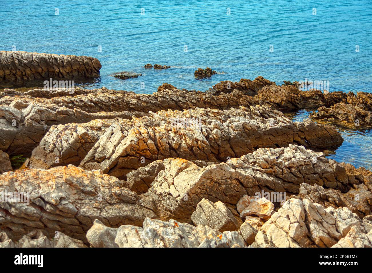 Ocean coast rock formation . Rocky coast and blue water Stock Photo - Alamy