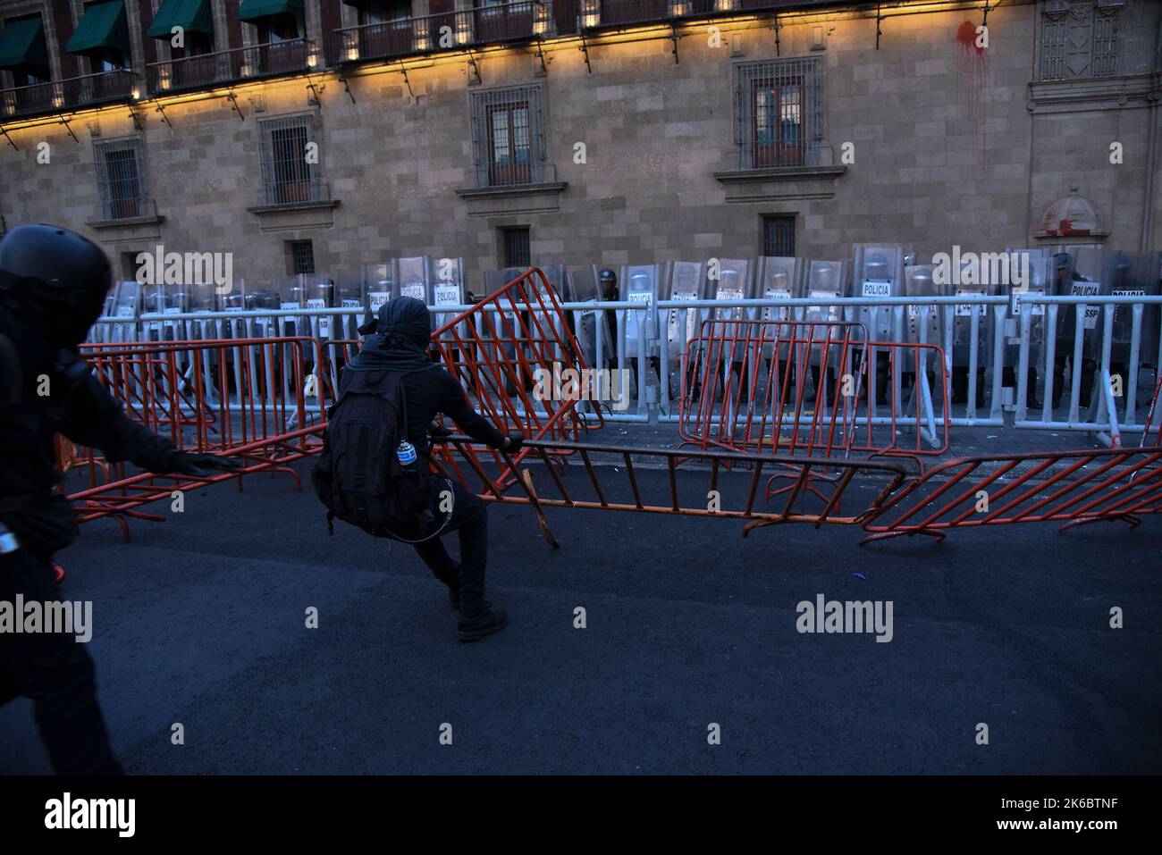 Mexico City, Mexico. 12th Oct, 2022. a group of hooded men confront a ...