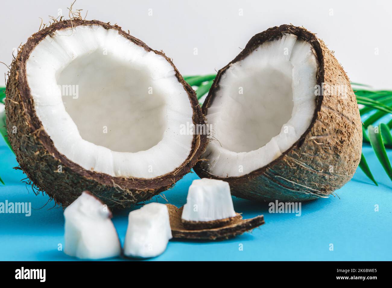 Damaged coconut pieces with shell close up Stock Photo - Alamy