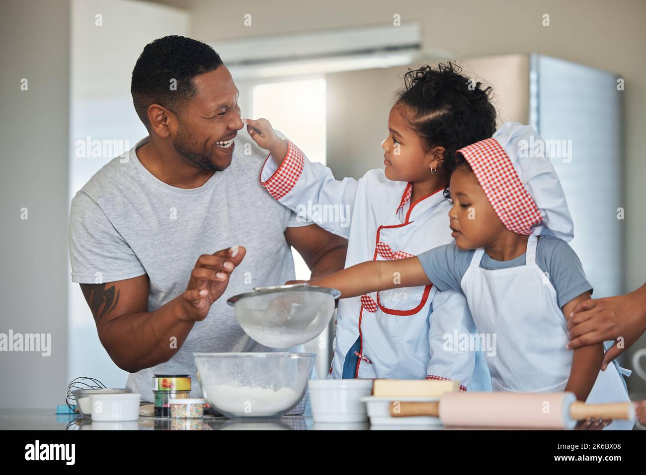 Baking is one of lifes sweet and simple pleasures. a father baking at ...