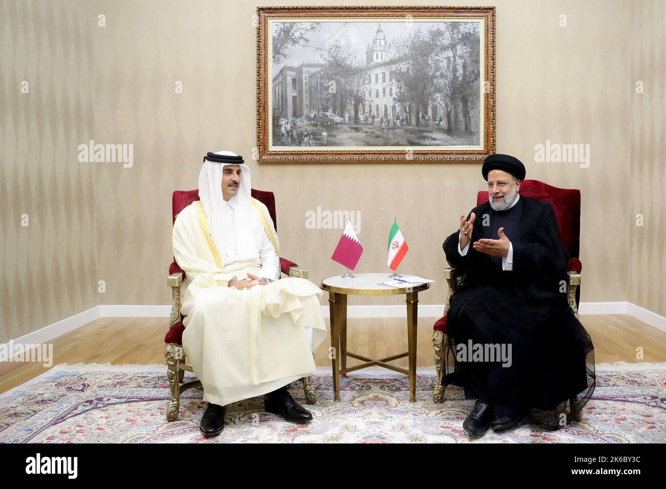 Emir of Qatar Tamim bin Hamad Al Thani (L) and Iran’s president Ebrahim ...