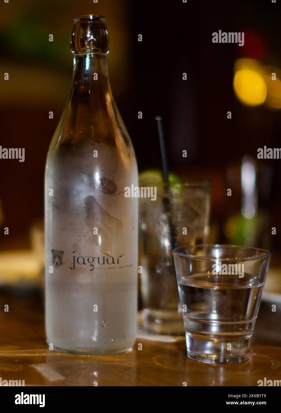 A vertical shot of a restaurant water container used for refilling ...