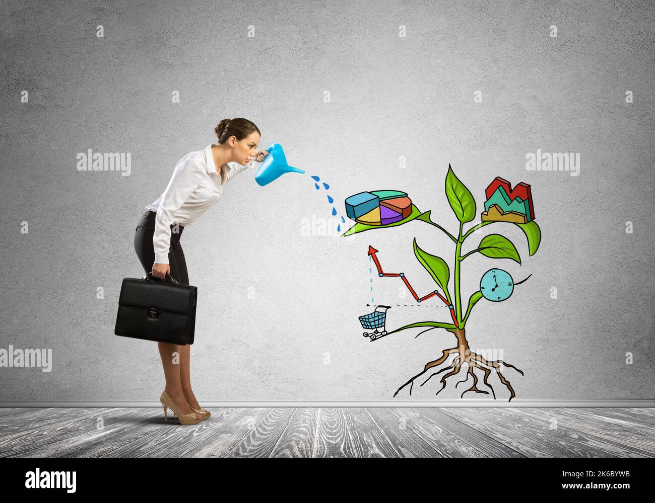Young businesswoman in empty room watering drawn growth concept with ...