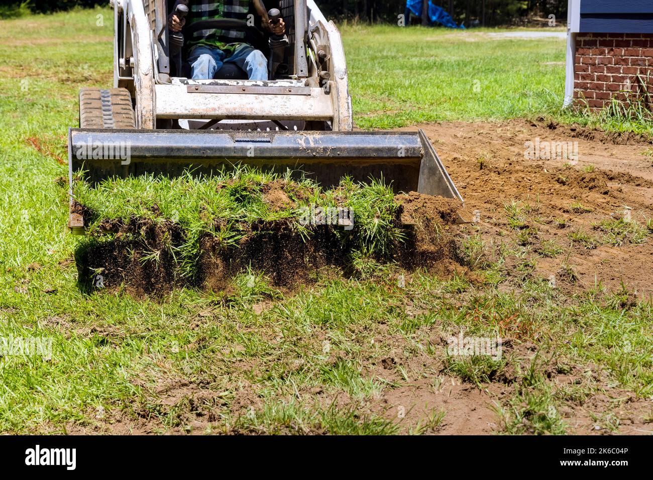 Using bulldozer for landscaping works, scoop to move earth around Stock ...