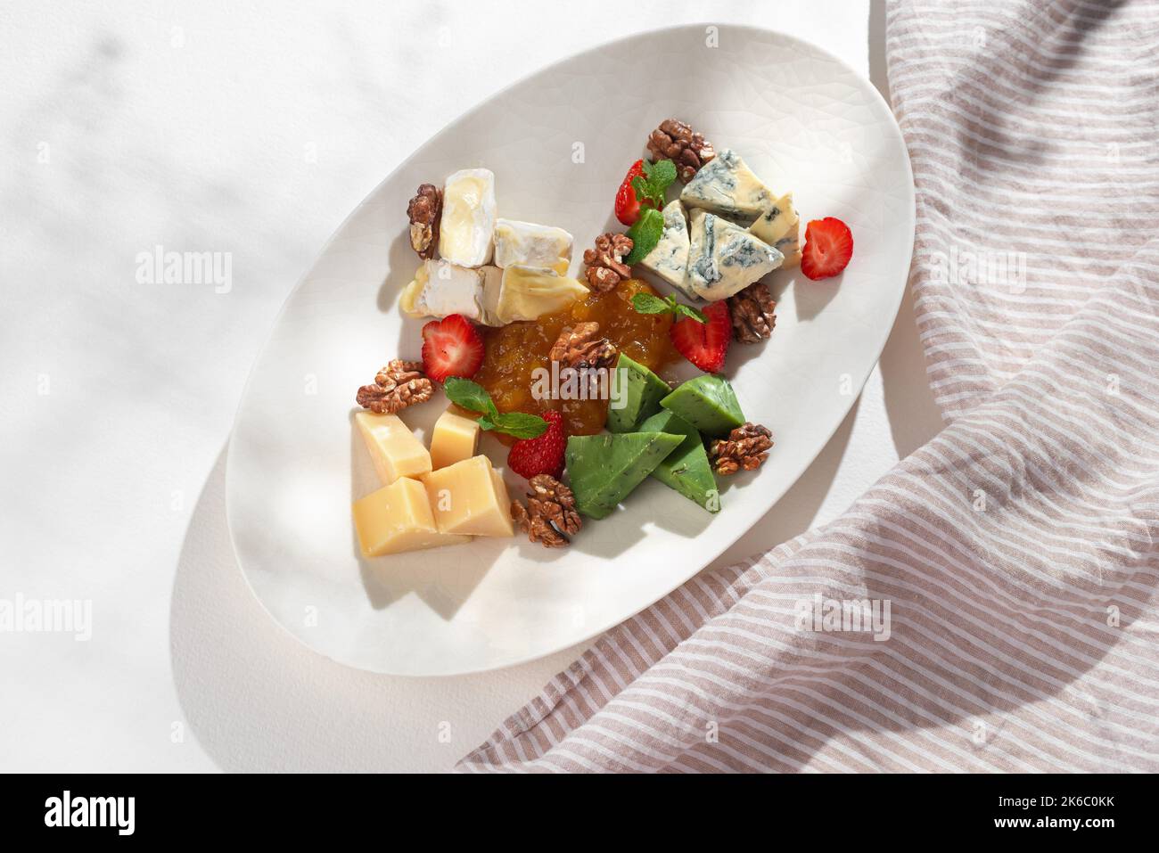Cheese platter with different cheese, pesto verde, gorgonzola, parmesan ...