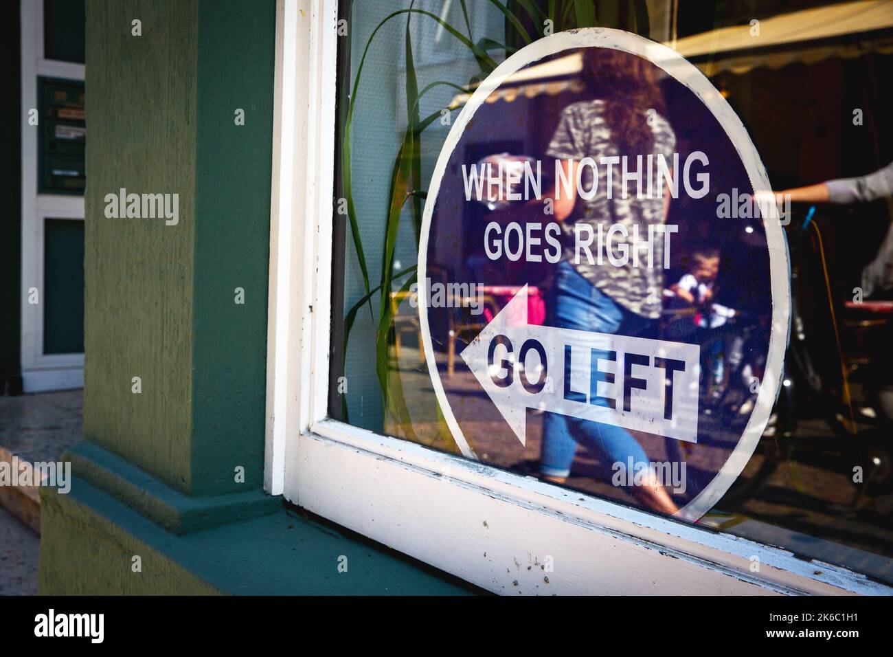Shop Window With The Inscription : "when Nothing Goes Right , Go Left ...
