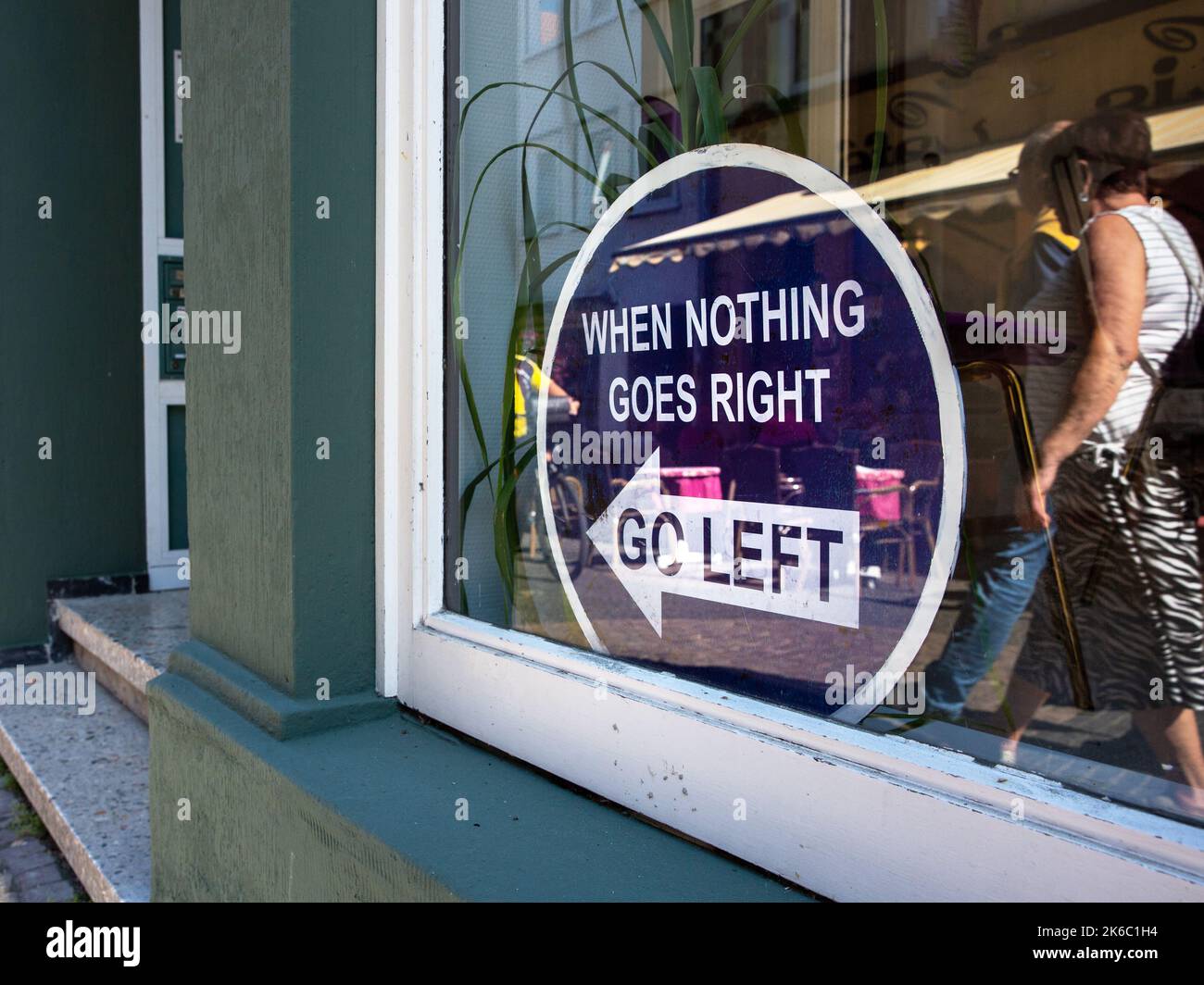 Shop Window With The Inscription : "when Nothing Goes Right , Go Left ...