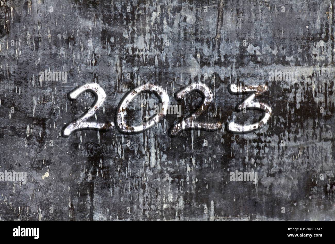 Inscription in numbers 2023, is lying on grey surface or background ...