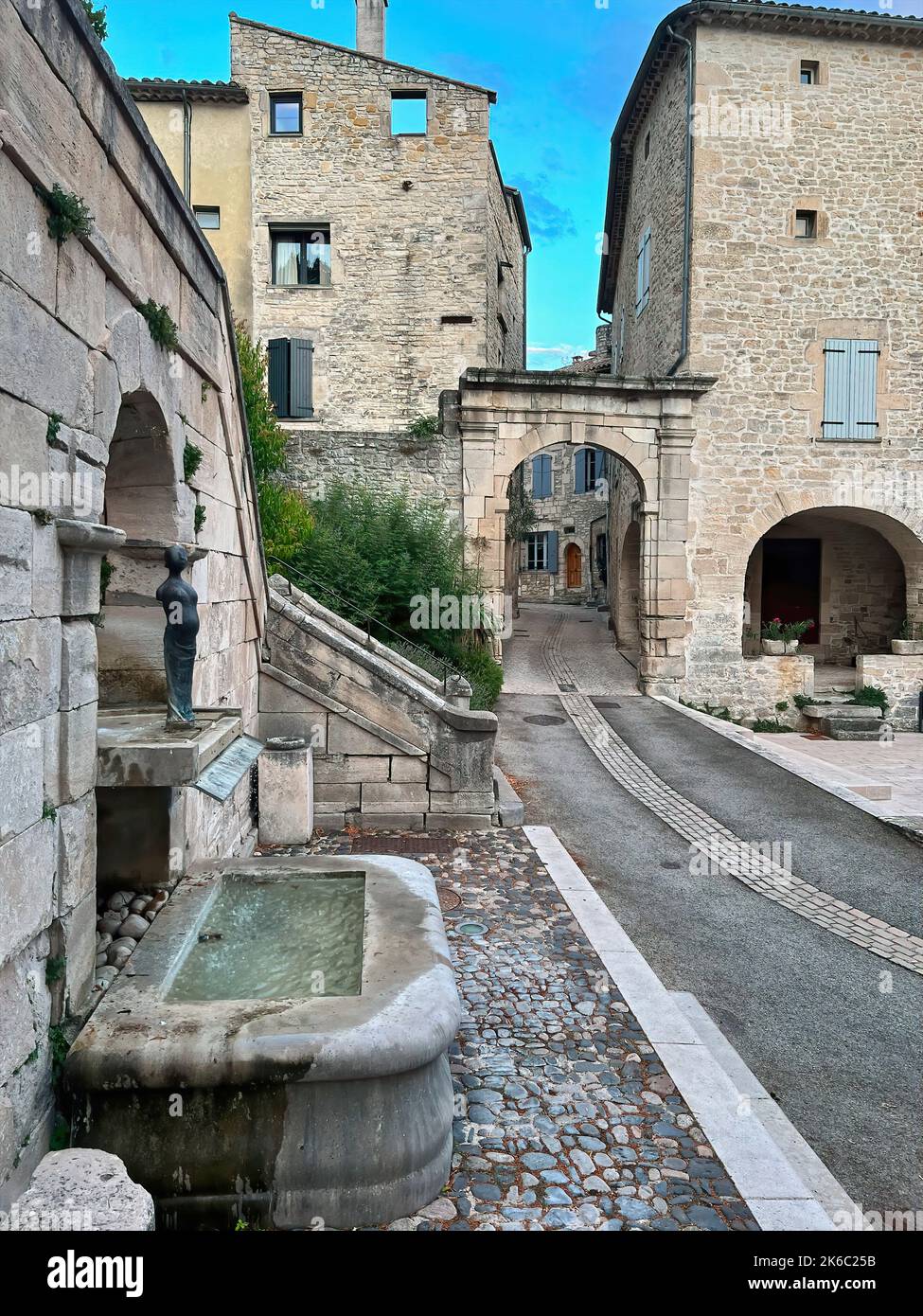 A vertical shot of ancient medieval buildings in Barjac village, France ...