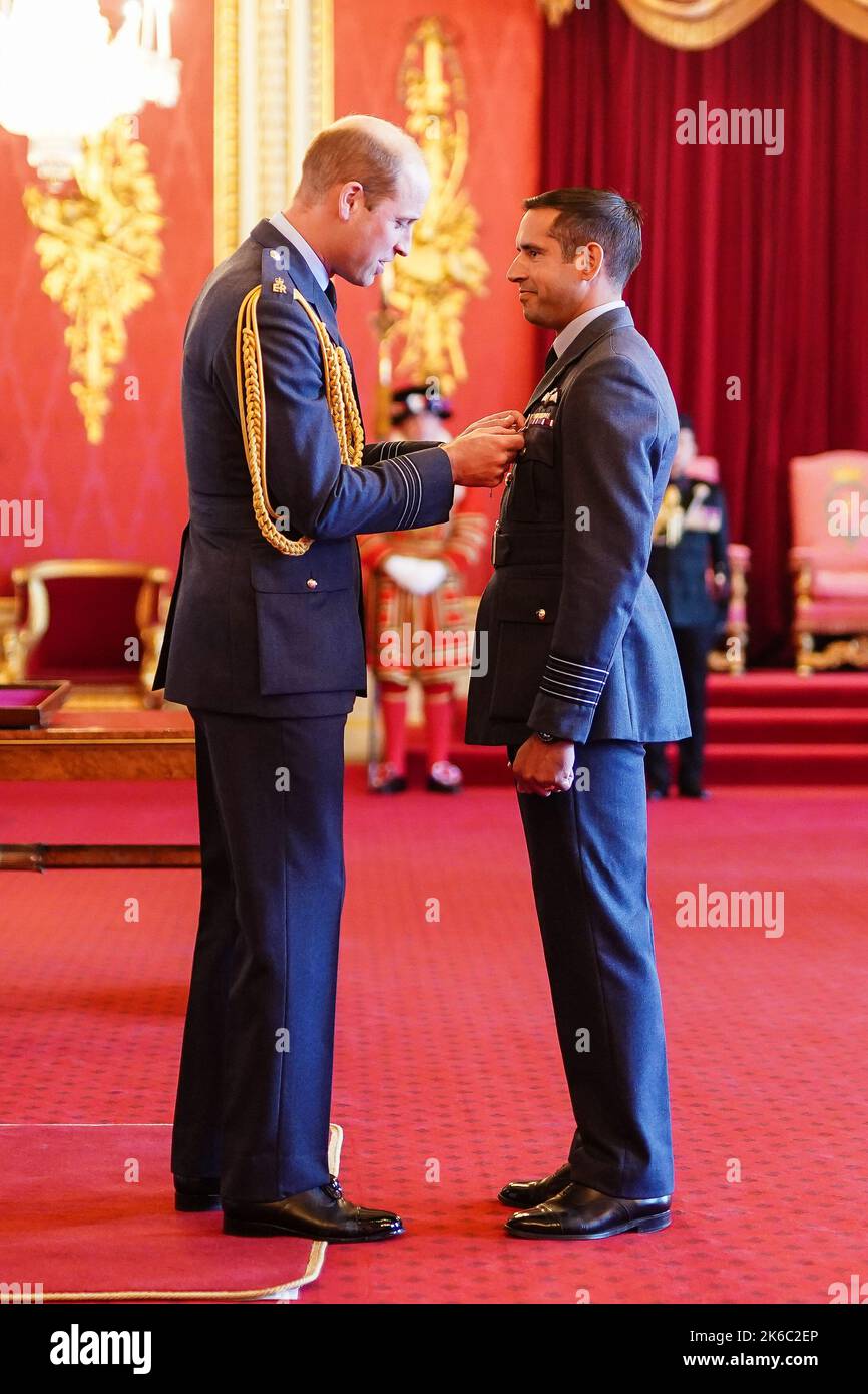 Group Captain Kevin Latchman, Royal Air Force, is decorated with the ...