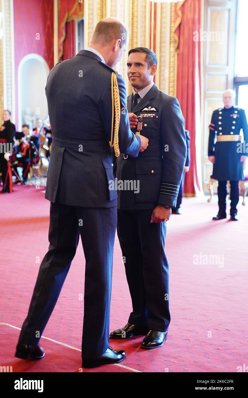 Group Captain Kevin Latchman, Royal Air Force, is decorated with the ...