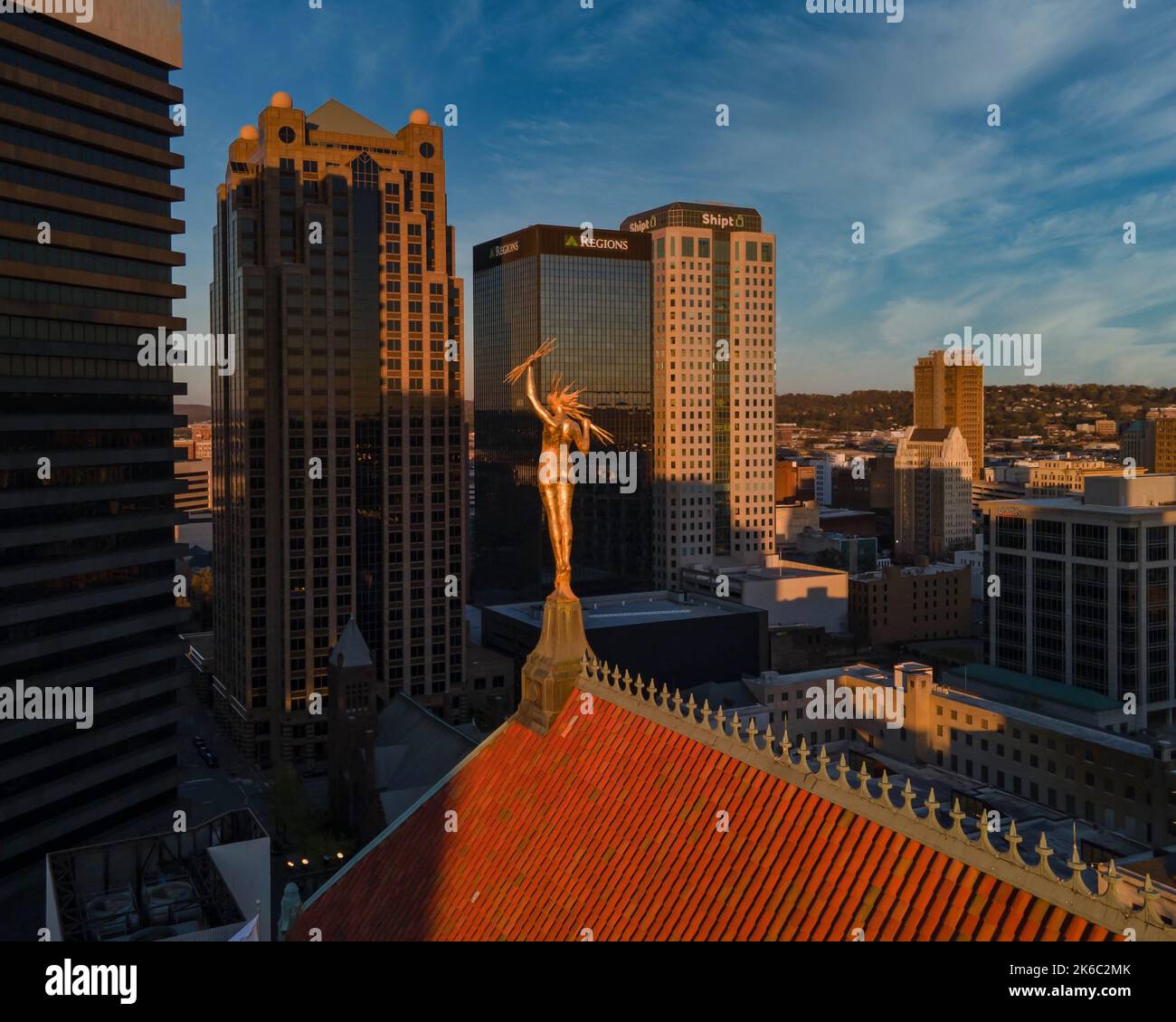 A drone shot of Miss Electra golden statue on the roof of Alabama Power ...
