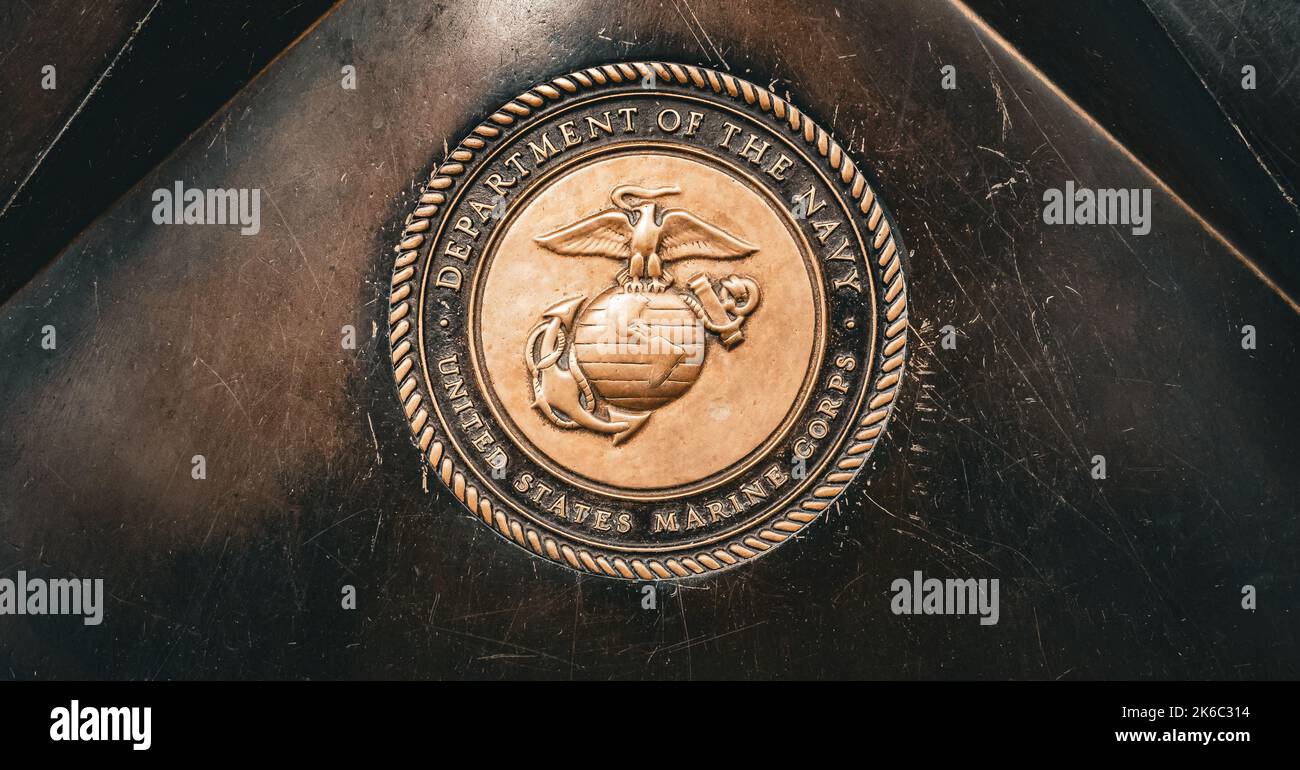 A closeup of a round brass symbol of the United States Department of ...