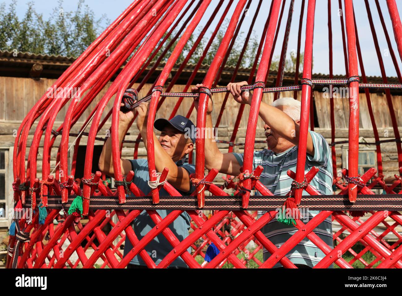 Erecting a Boz Uy (Kyrgyz Yurt) - binding Uuk for stability (Step 11 of ...