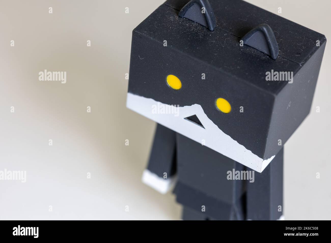 A closeup of a cat - black and white Danbo Toy on white background ...