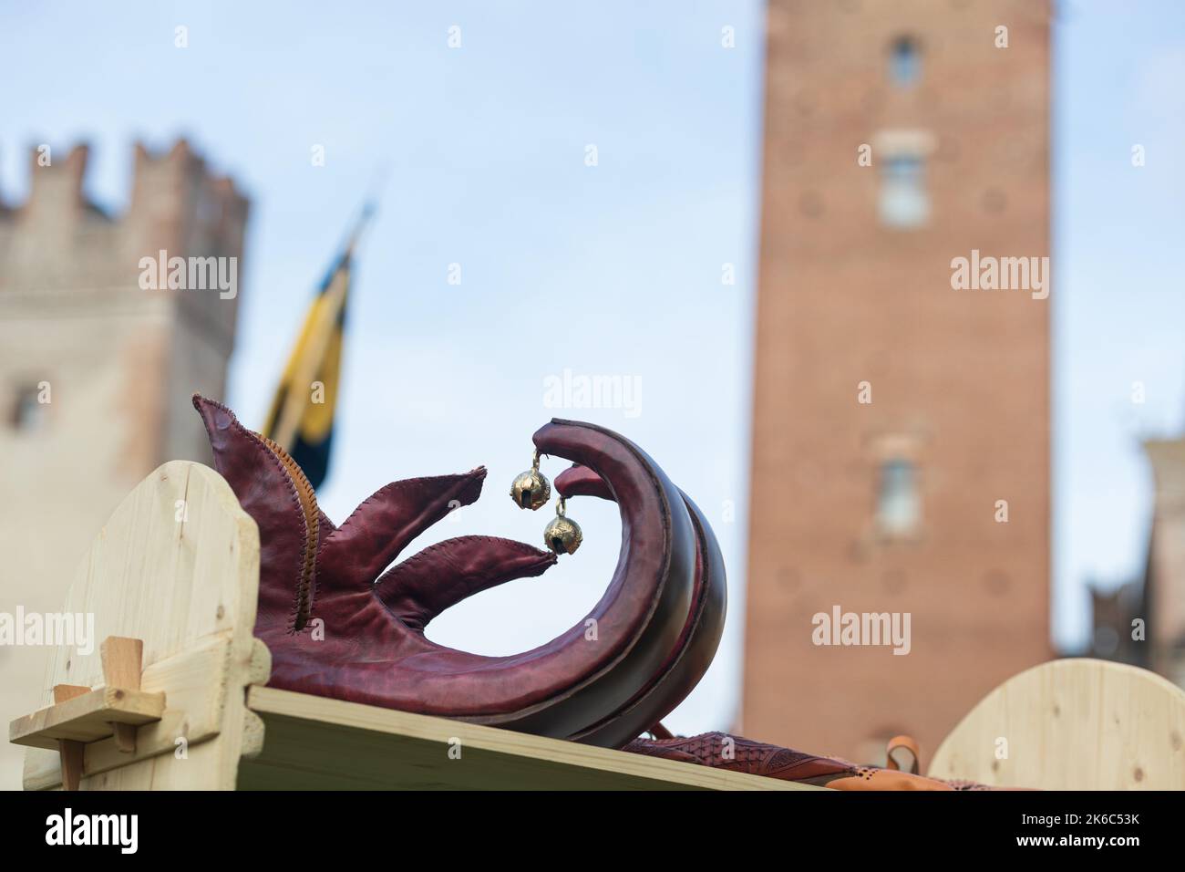 Jester shoes on a medieval market bench Stock Photo - Alamy