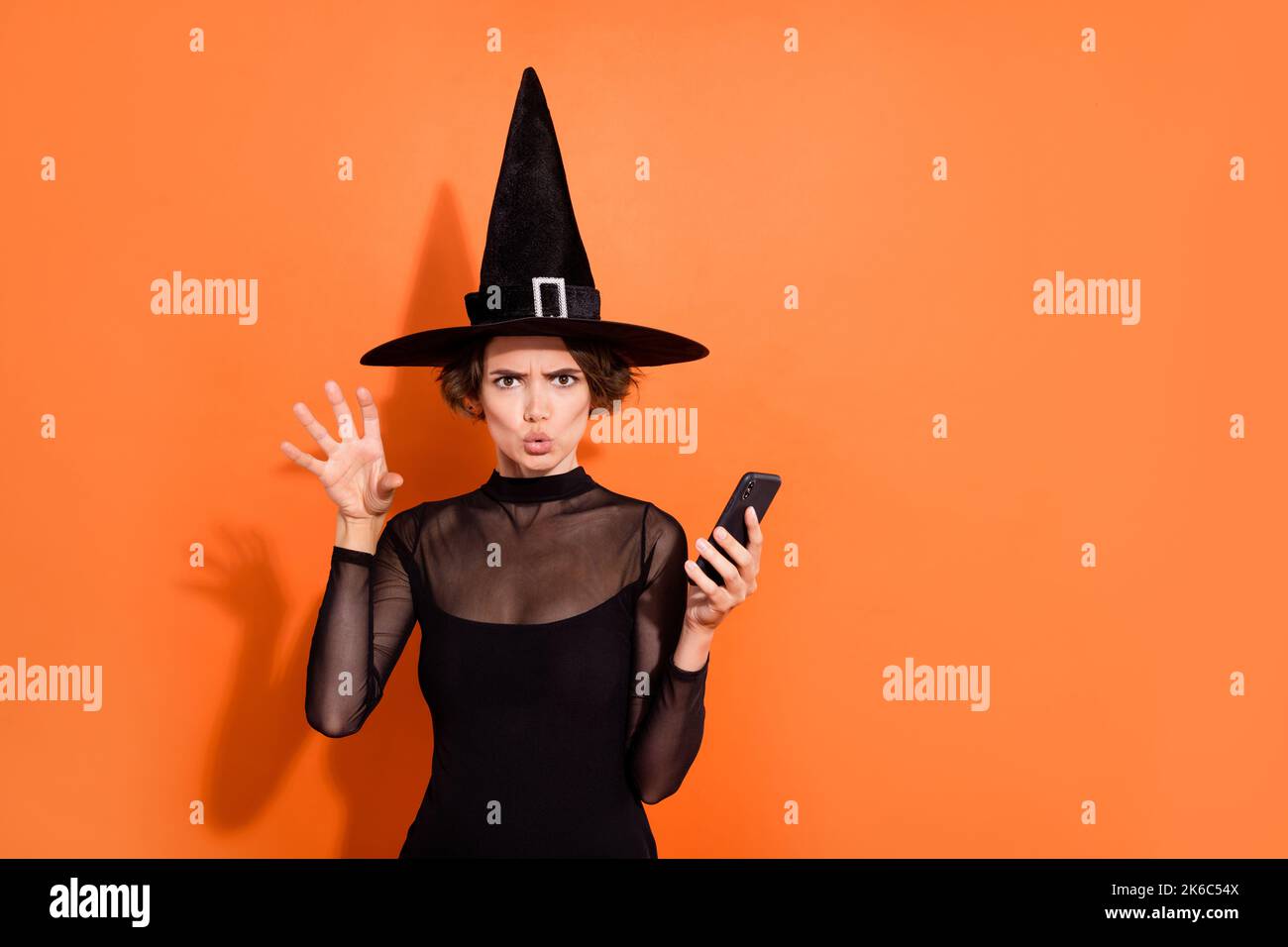 Photo of attractive terrifying lady hold telephone arm make scary boo ...