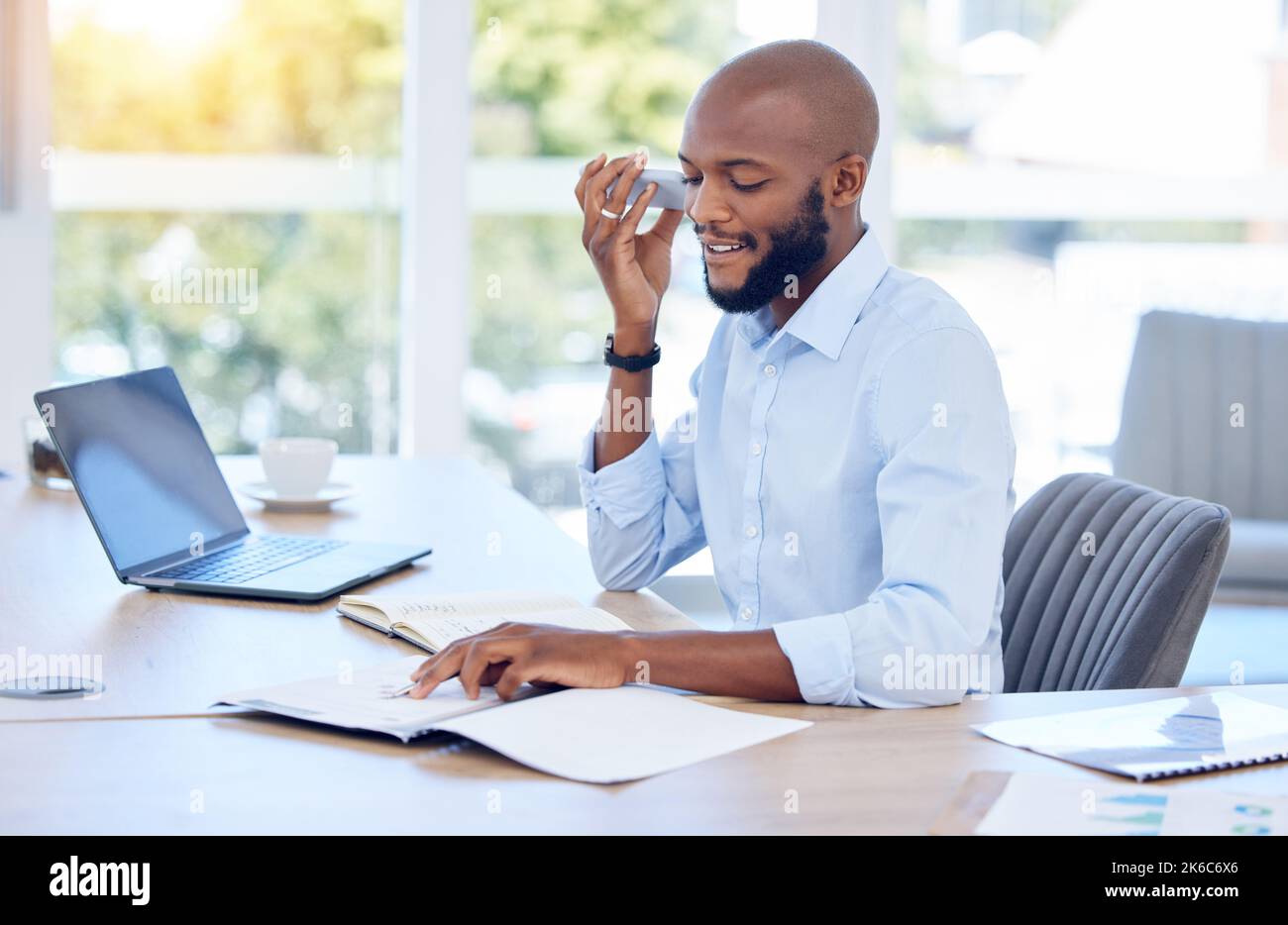 I can help you with that. a young businessman on a call at work Stock Photo - Alamy