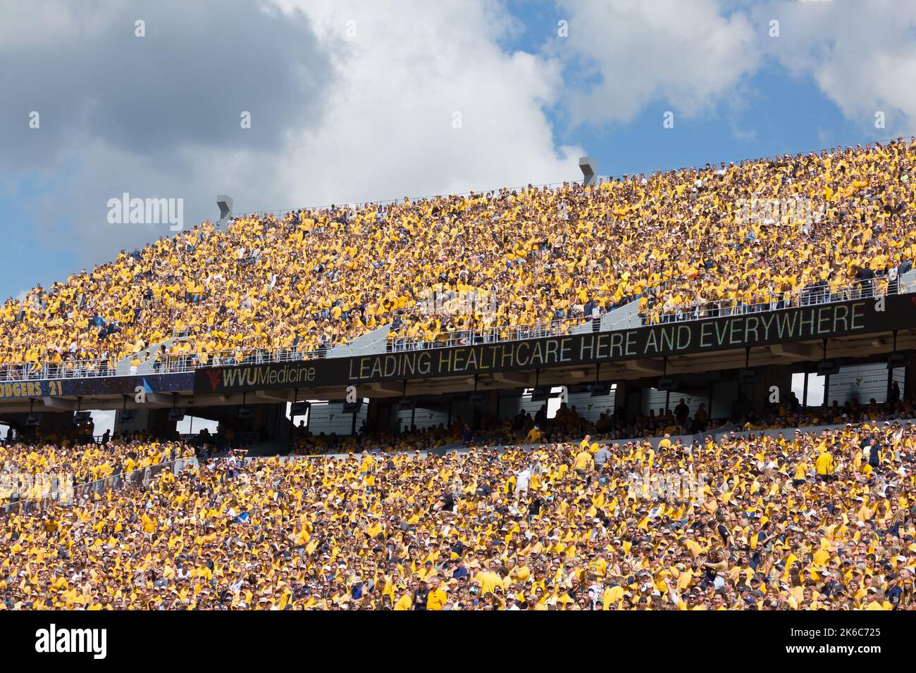 The football fans in the stadium at a West Virginia University college ...