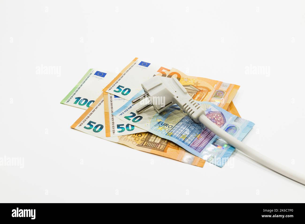 Electric plug and euro money banknotes. Concept of the increasing ...