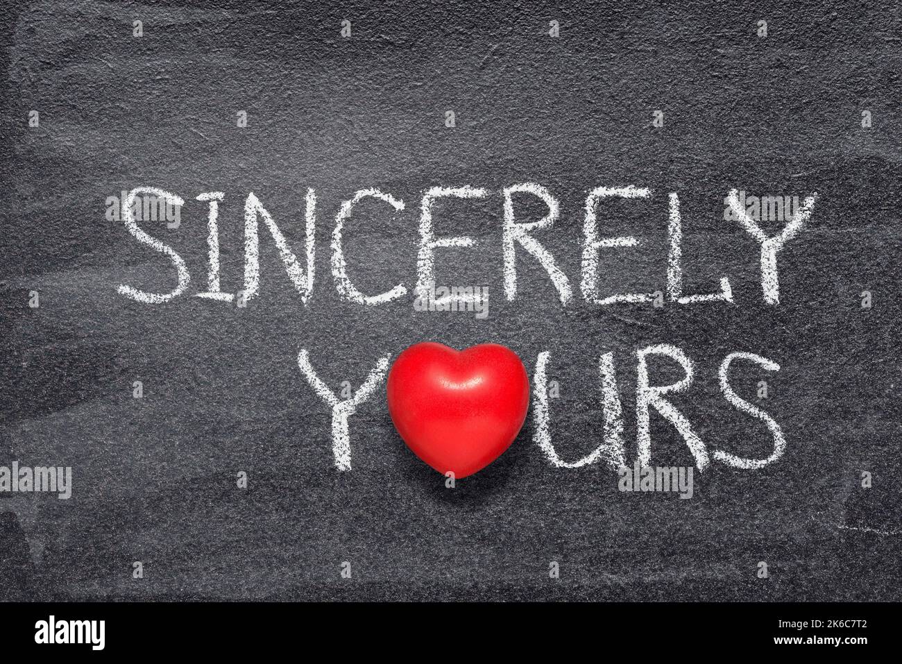 sincerely yours phrase written on chalkboard with red heart symbol ...