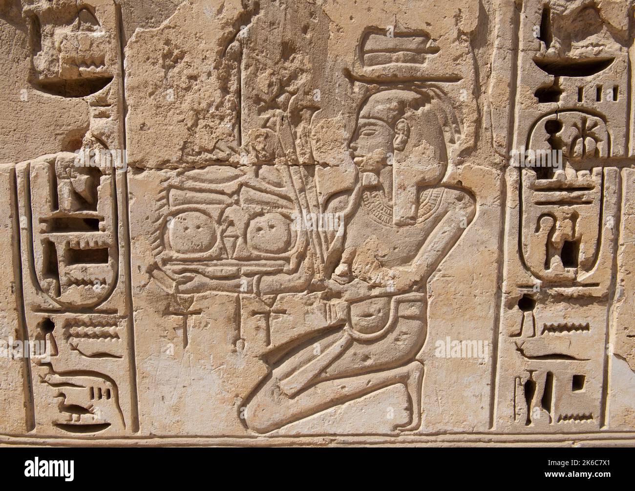 Hieroglypic carvings on wall at the ancient egyptian Medinat Habu ...