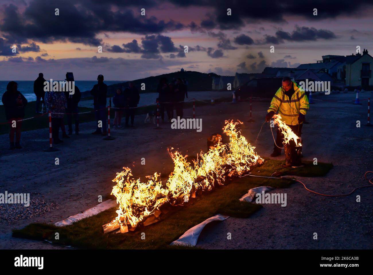 A fire being prepared for a Firewalking session held in support of a ...