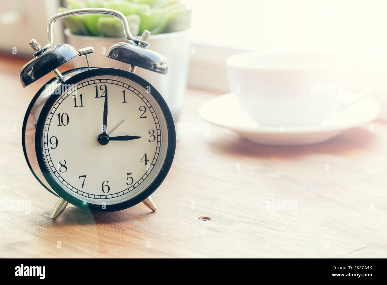 Morning sun. Alarm clock on a beautiful background Stock Photo - Alamy