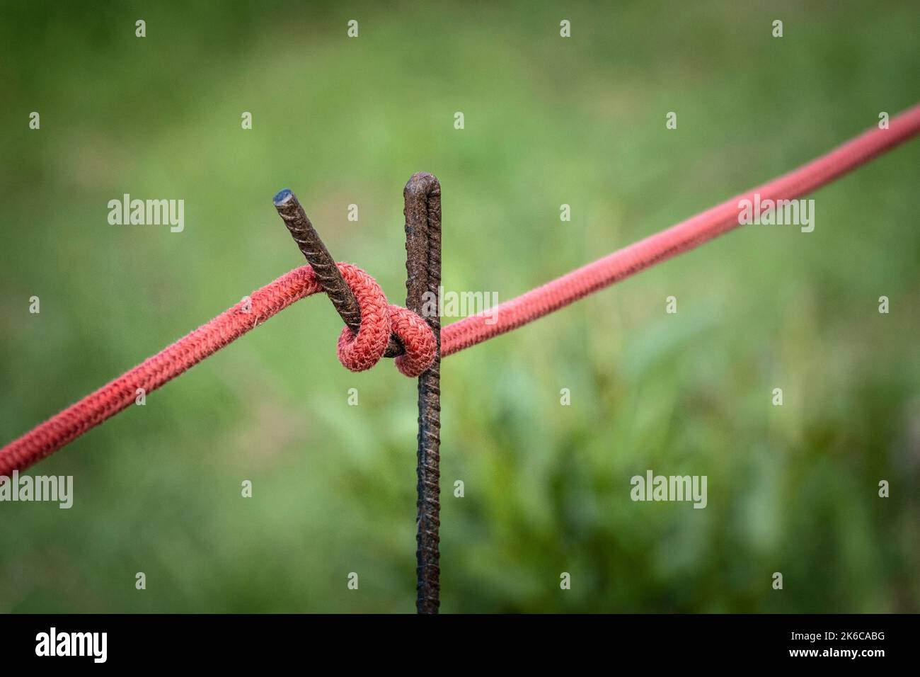 Closeup of rope wrapped around a metal spike Stock Photo - Alamy