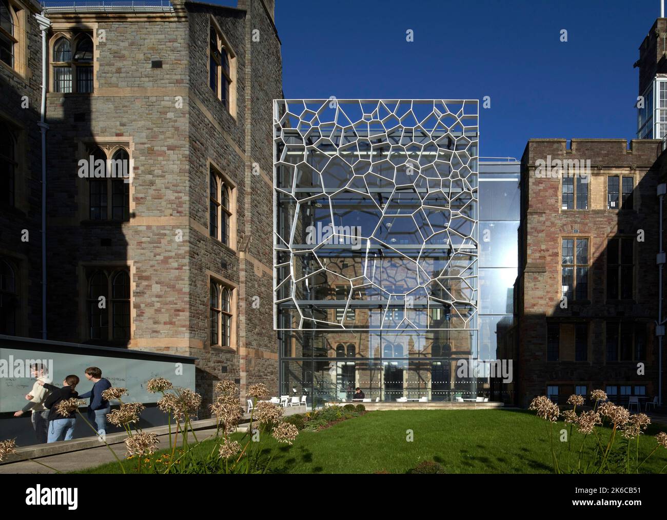 View with students and professor working a formula. University of ...