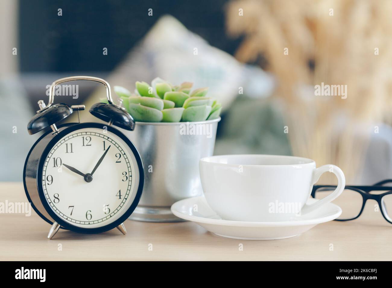 Morning sun. Alarm clock on a beautiful background Stock Photo - Alamy