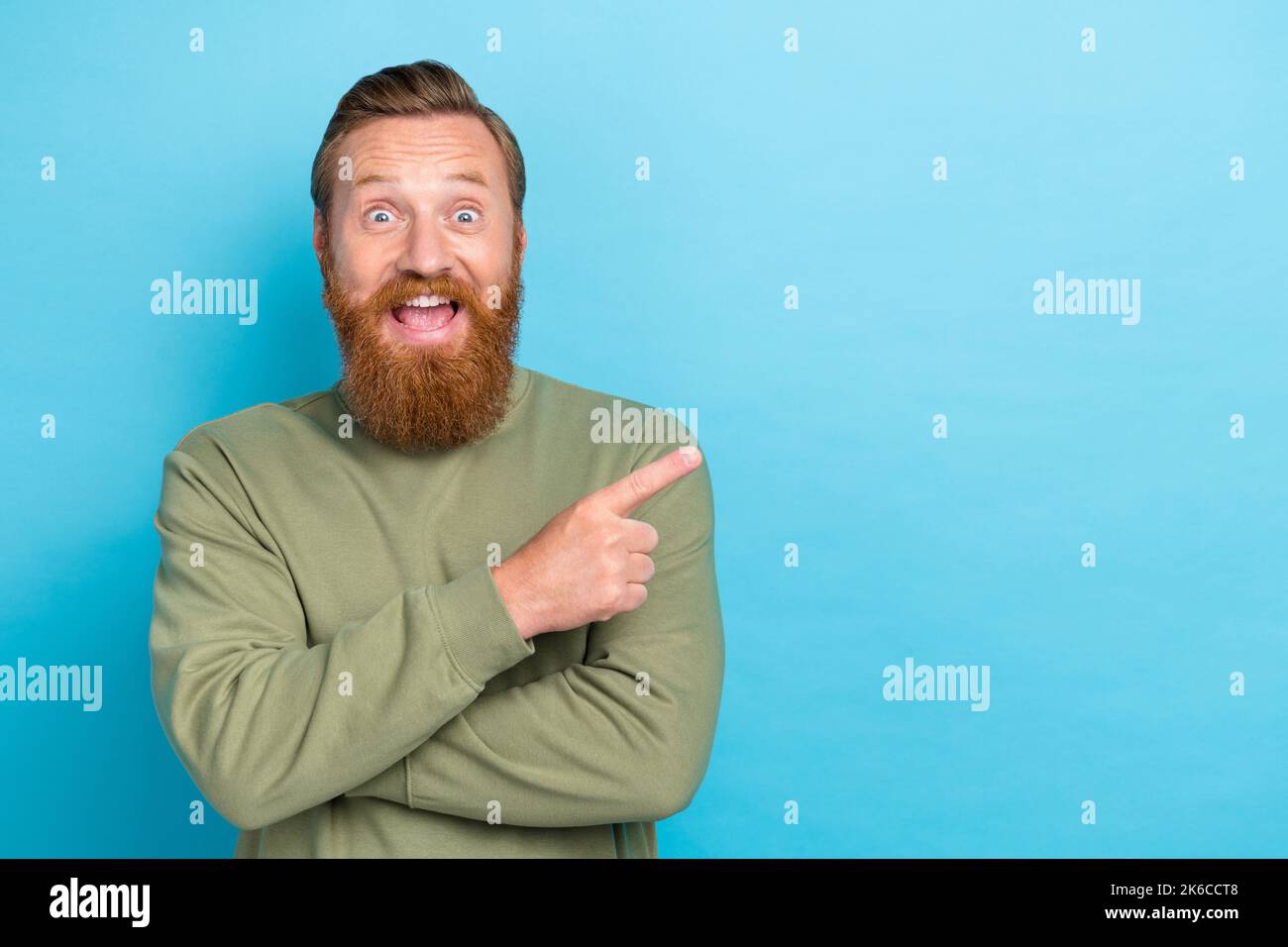 Photo of speechless staring crazy man with red hairstyle dressed khaki ...