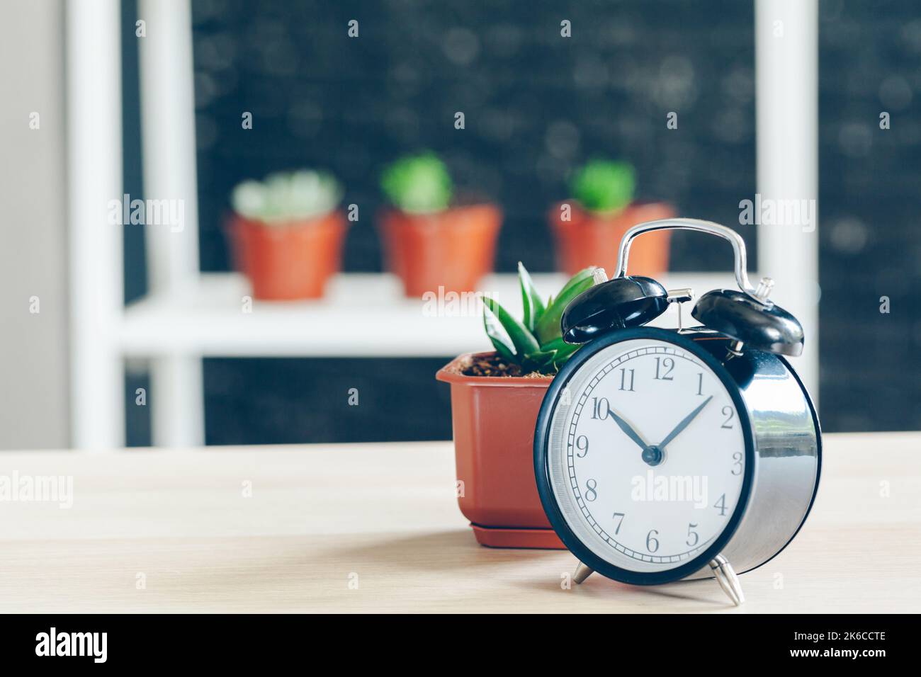 Morning sun. Alarm clock on a beautiful background Stock Photo - Alamy