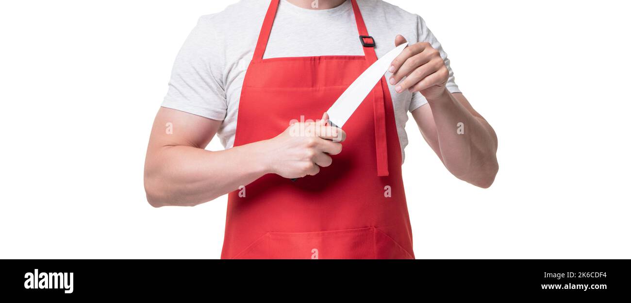cropped view of chef in red apron hold knife isolated on white ...