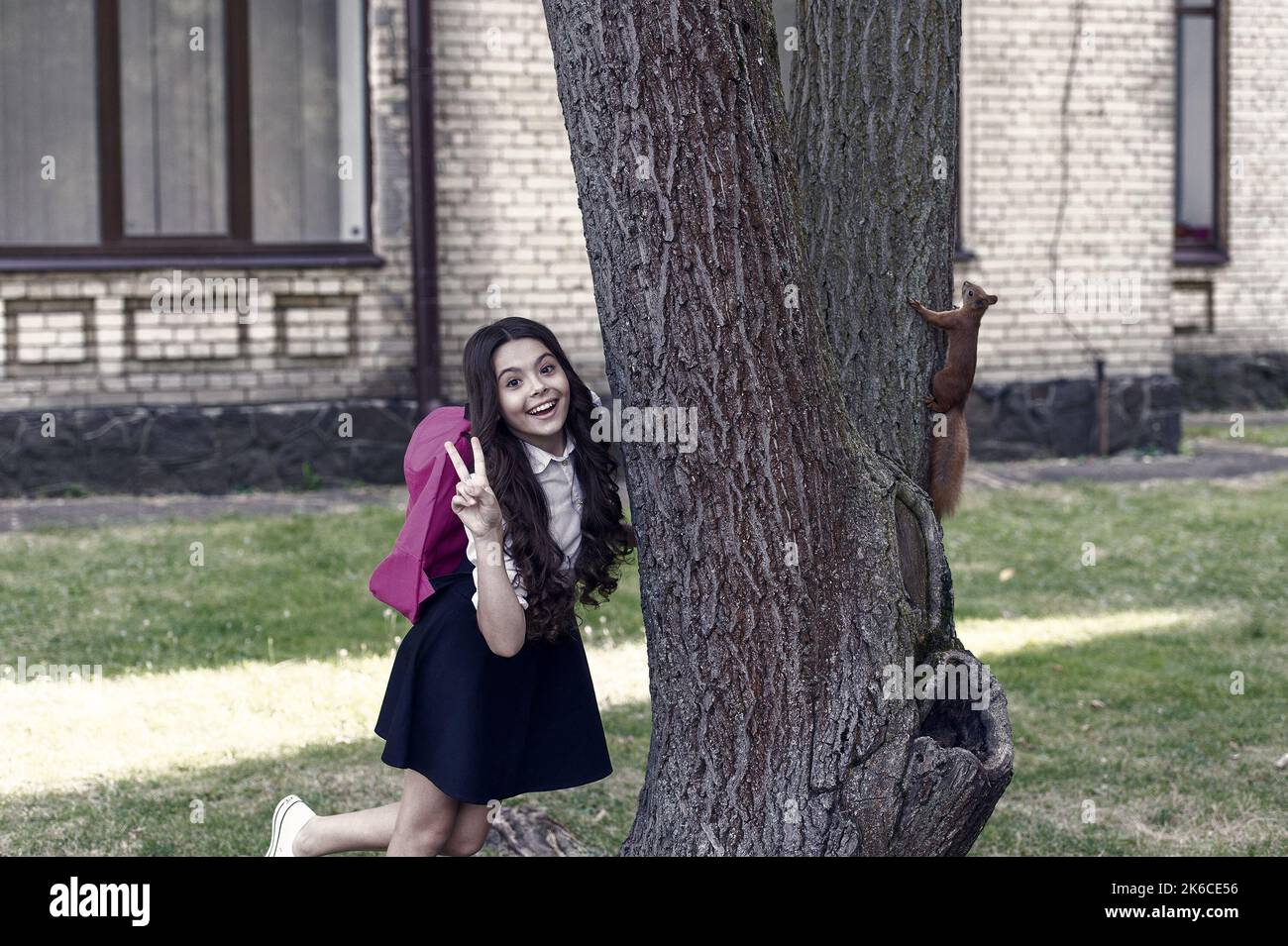 Passionate about studying Zoology. Happy child show peace sign. Red ...