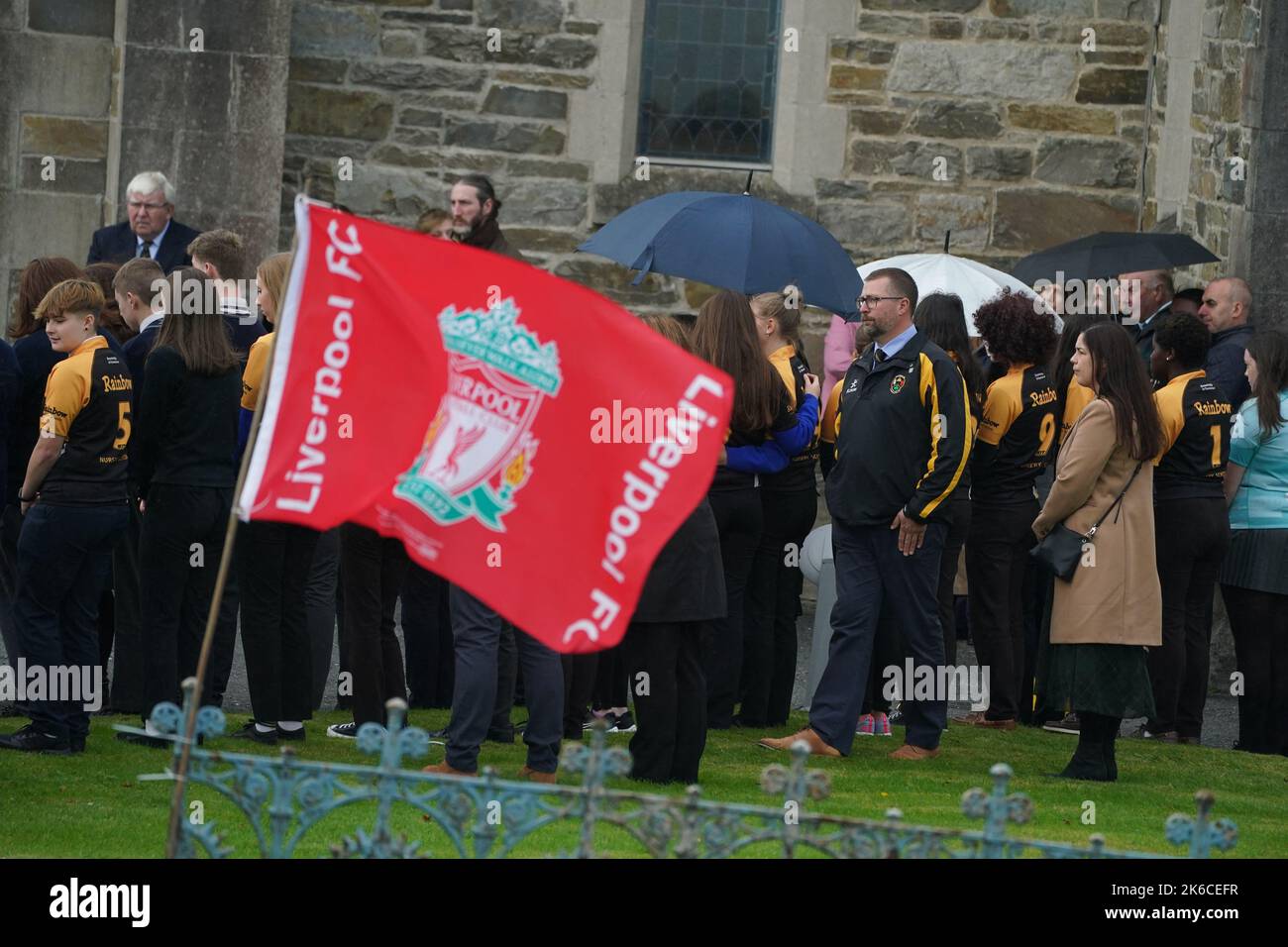A Liverpool FC flag is flown as members of Letterkenny Rugby Club join ...
