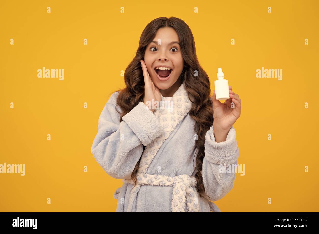 Amazed teen girl. Girl hold medicine nasal spray from running nose ...