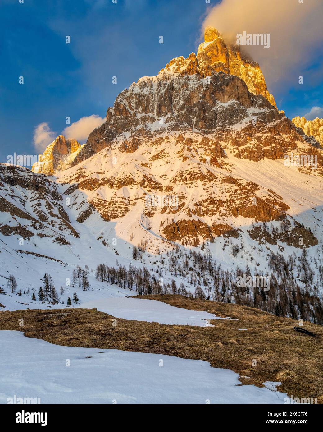 A vertical shot of the Dolomites mountains covered in snow, Italy Stock ...