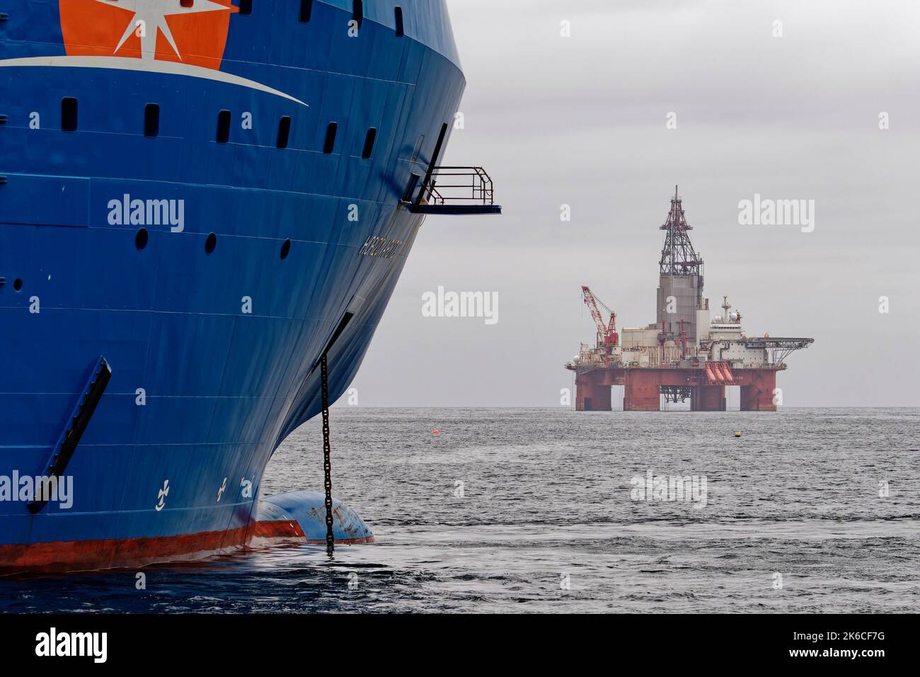 The West Hercules drilling rig moored near shore and the Horizon Arctic ...