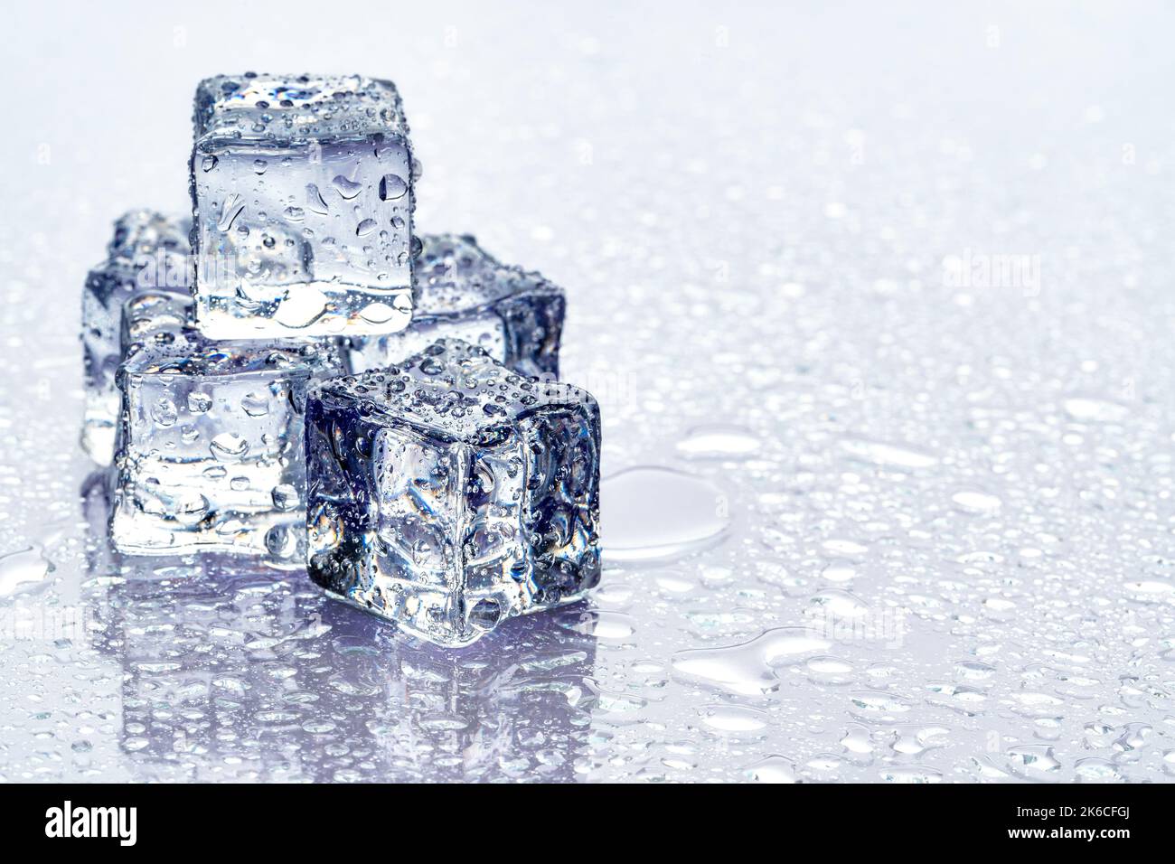 ice cubes on blue background Stock Photo - Alamy